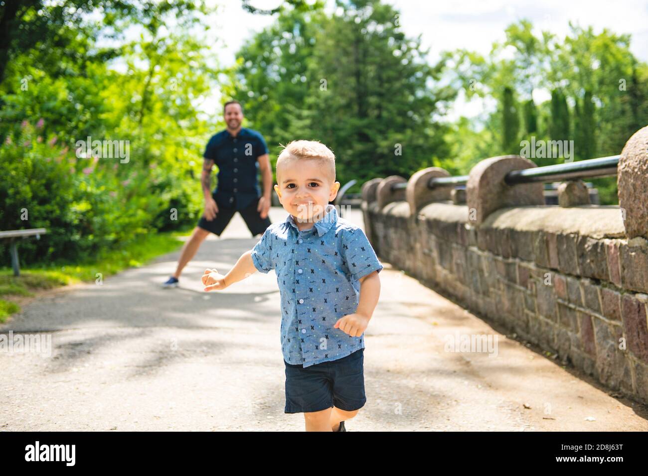 A Happy father having fun with his son on the park Stock Photo - Alamy