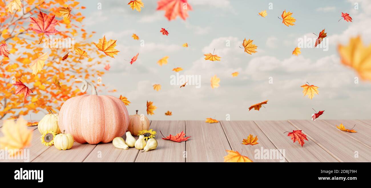 Autumn seasonal background with falling leaves and pumpkins on wooden ...