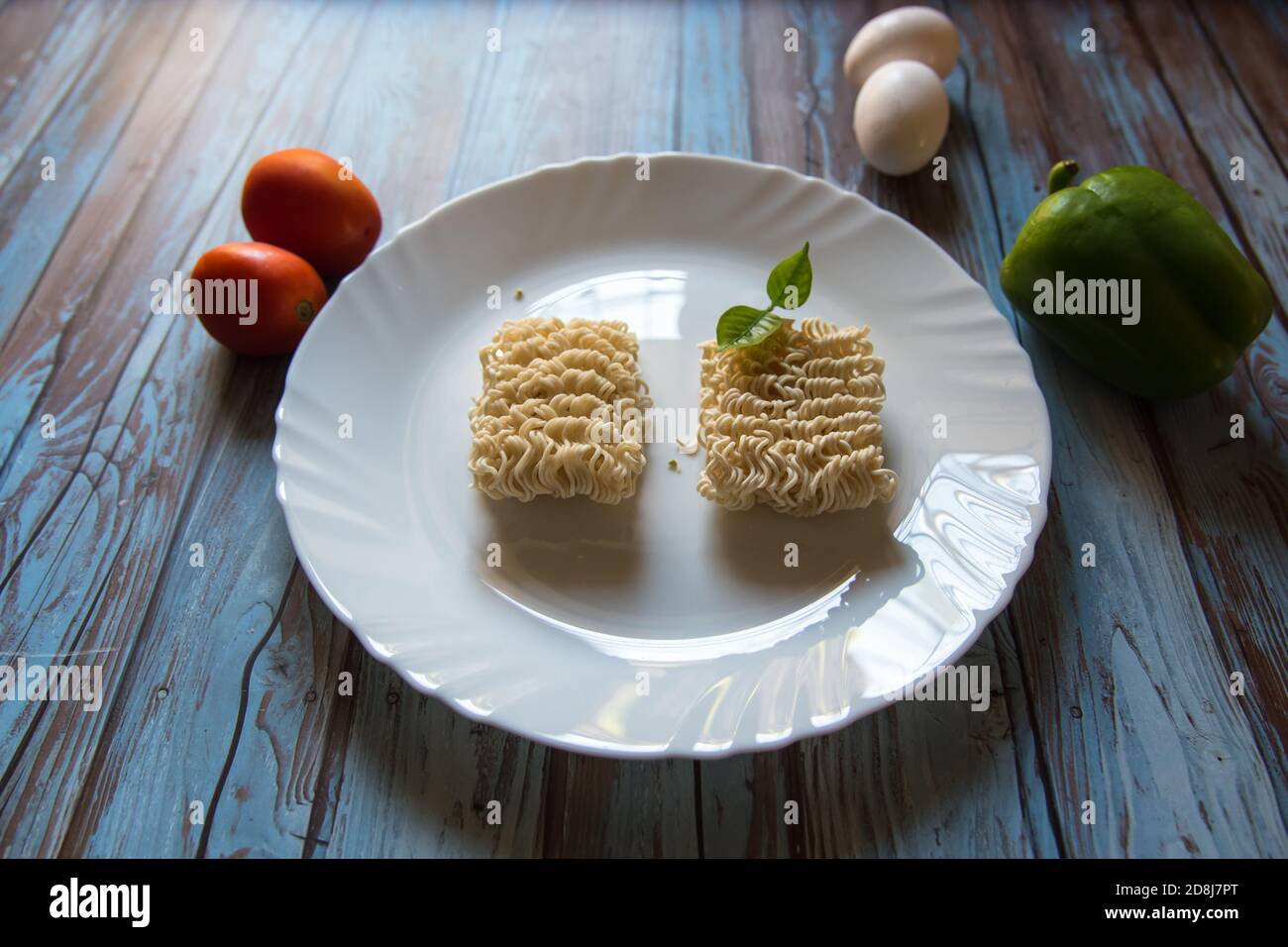 Delicious ramen noodles in a plate along with condiments Stock Photo ...