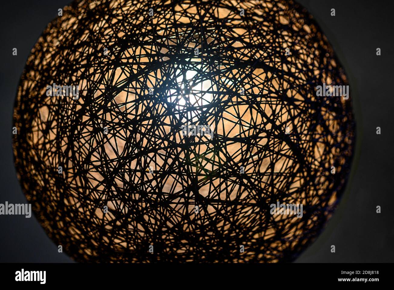 Interior lighting is on. Round decorative with wicker texture over lamp ...