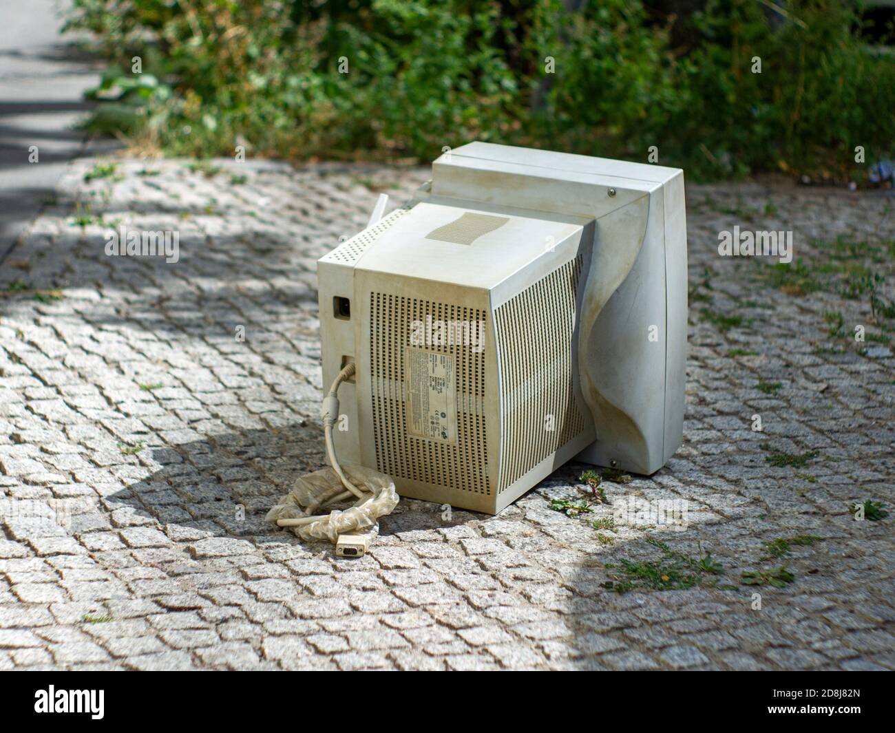Old computer monitor dumped on the street Stock Photo - Alamy