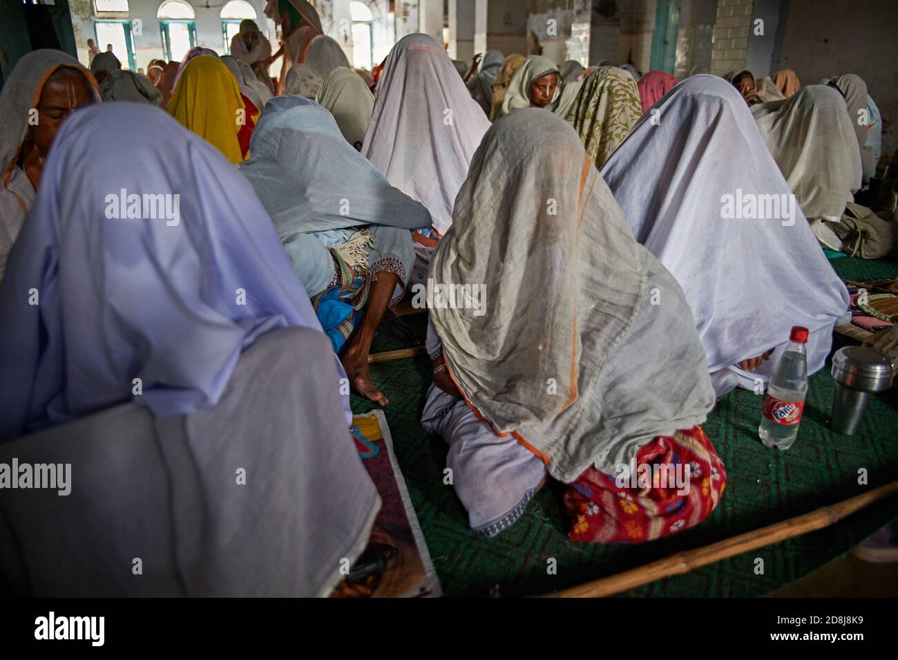 Vrindavan, India, August 2009. Widows praying inside an ashram Stock ...