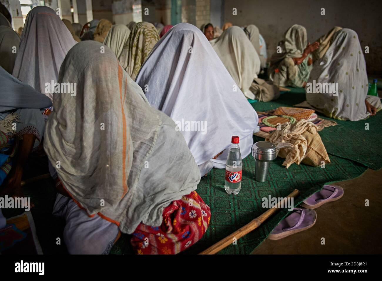 Vrindavan, India, August 2009. Widows praying inside an ashram Stock ...