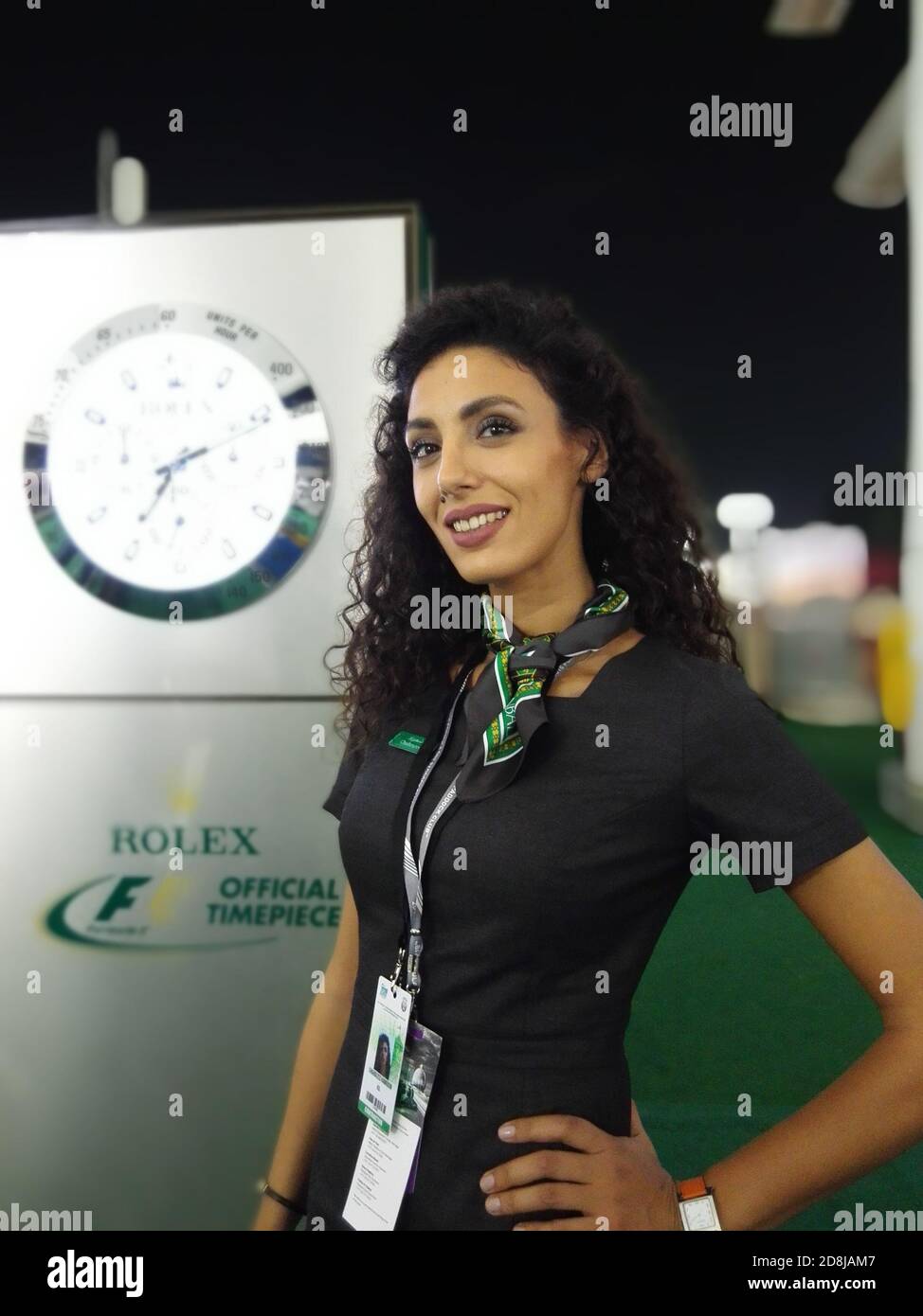 A beautiful Arab girl a VIP Host smiles at the camera with a big Rolex ...