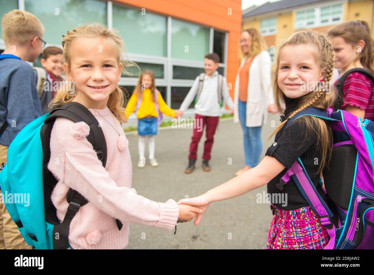 group of kids on the school background having fun Stock Photo - Alamy