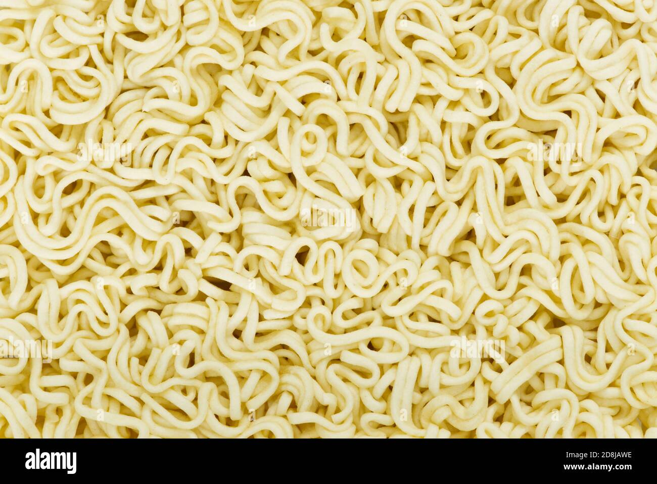 Full frame yellow Instant noodles for background Stock Photo - Alamy