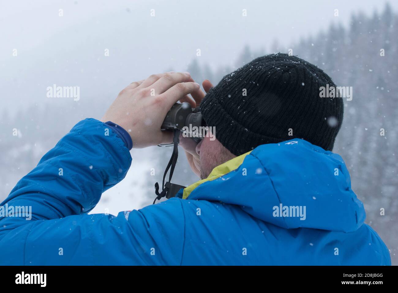 a person looking through binoculars to view far away objects Stock ...