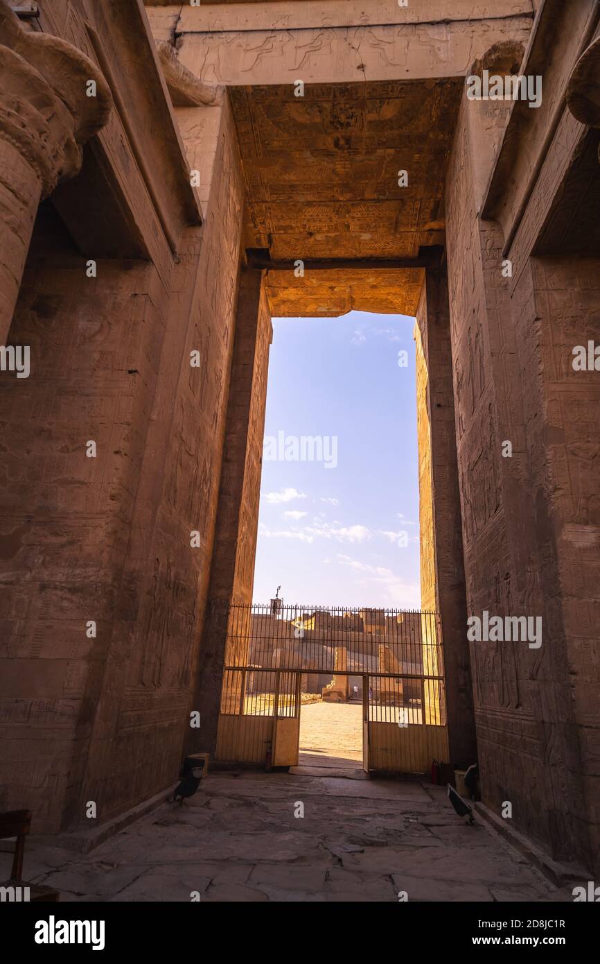 Vertical low angle shot of the main entrance in The Temple of Horus at ...