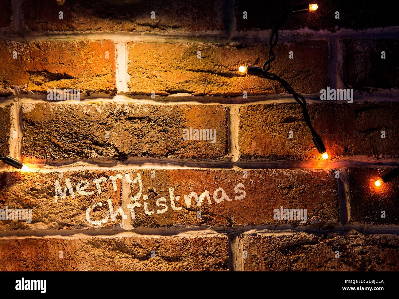 christmas vintage brick wall background with lights glowing card Stock ...