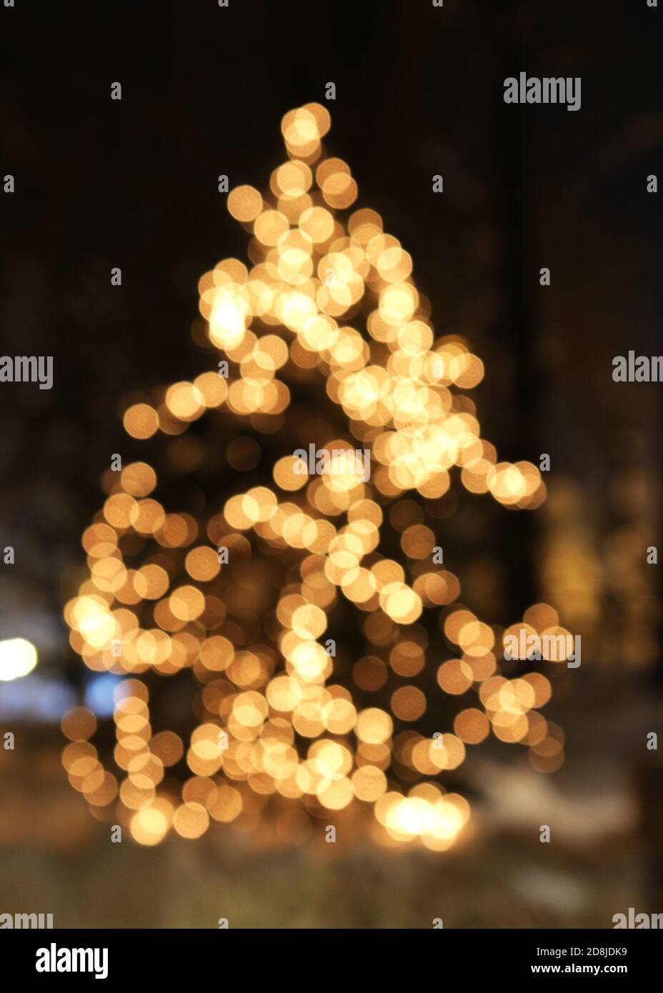 Christmas tree with lights glowing and snow Stock Photo - Alamy