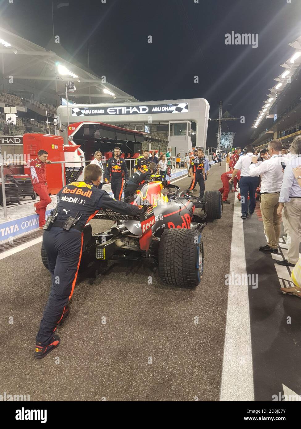 The technical team push the car to the garage after the race, seen from ...