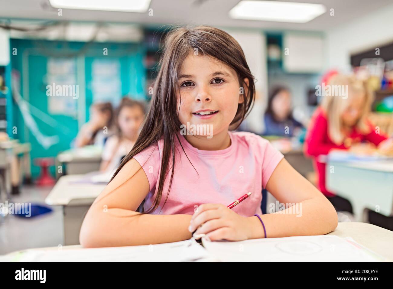 education and school concept little student girl studying at school ...