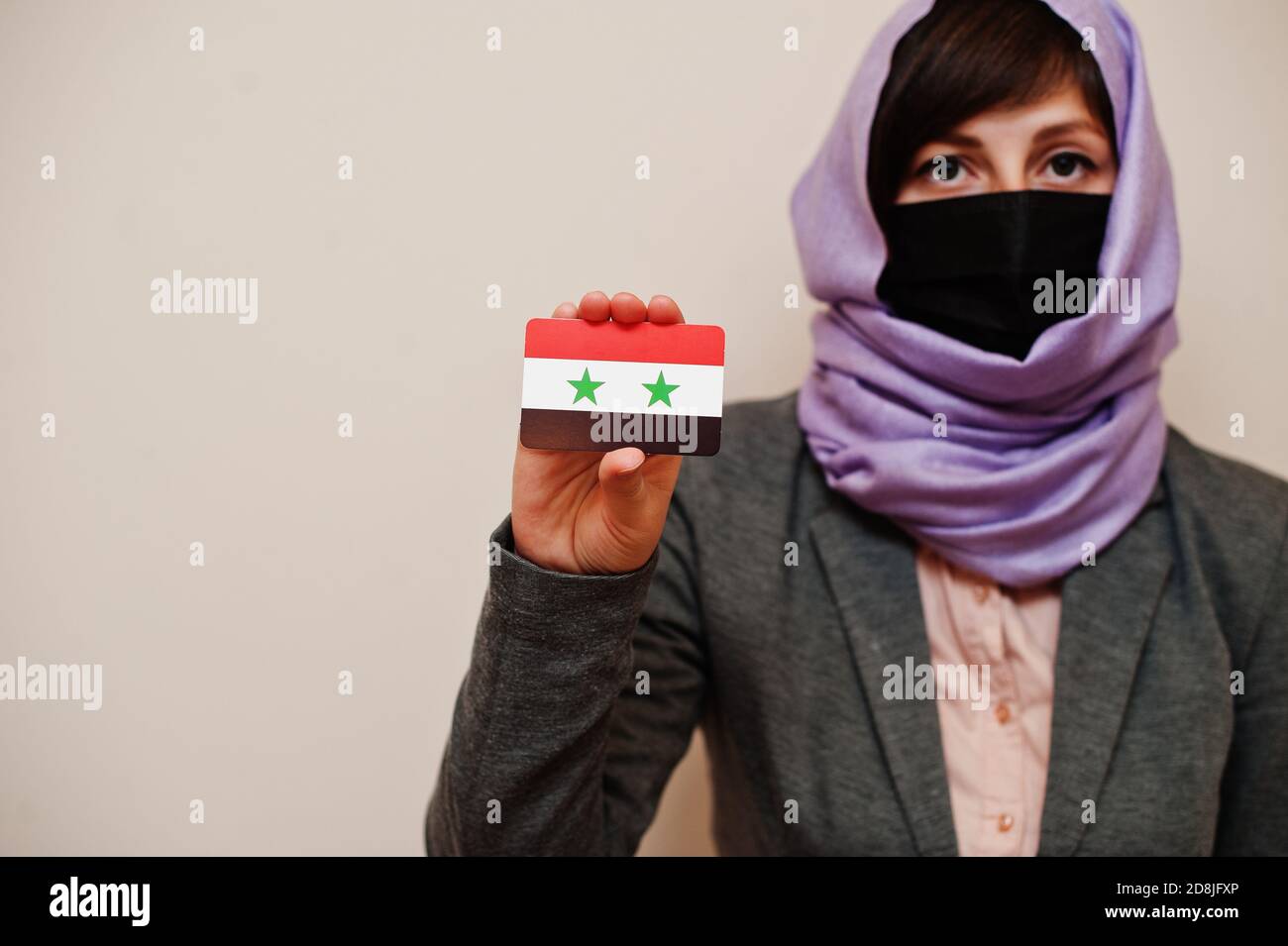 Portrait of young muslim woman wearing formal wear, protect face mask ...