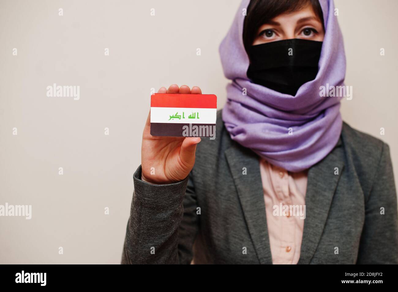 Portrait of young muslim woman wearing formal wear, protect face mask ...