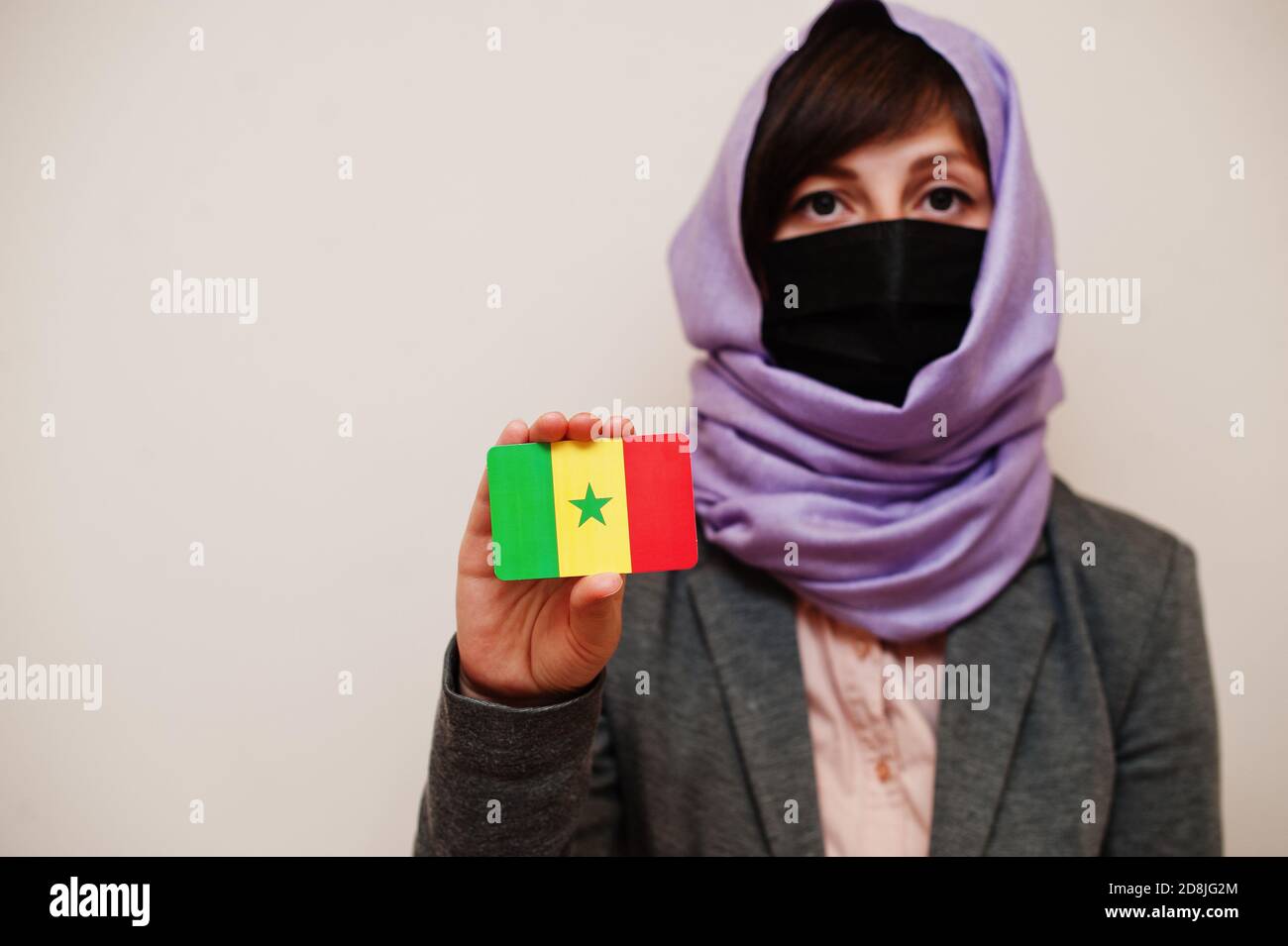 Portrait of young muslim woman wearing formal wear, protect face mask ...
