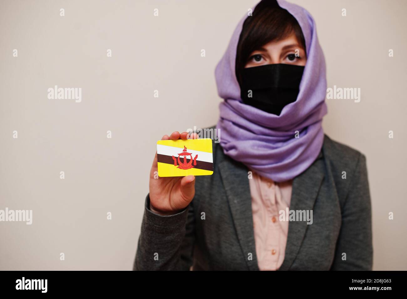 Portrait of young muslim woman wearing formal wear, protect face mask ...