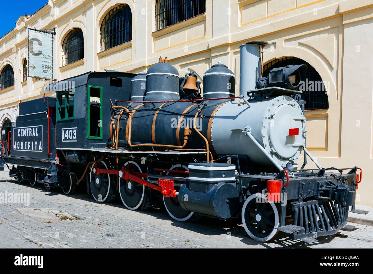 Old steam locomotive next to Almacenes San José Artisans' Market. La ...