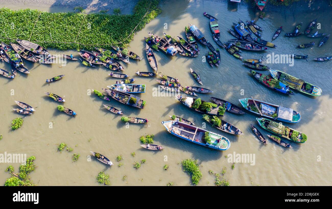 Boithakata floating market on the Belua River under Nazirpur upazila of ...