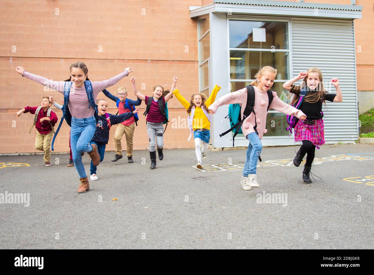 group of kids on the school background having fun Stock Photo - Alamy