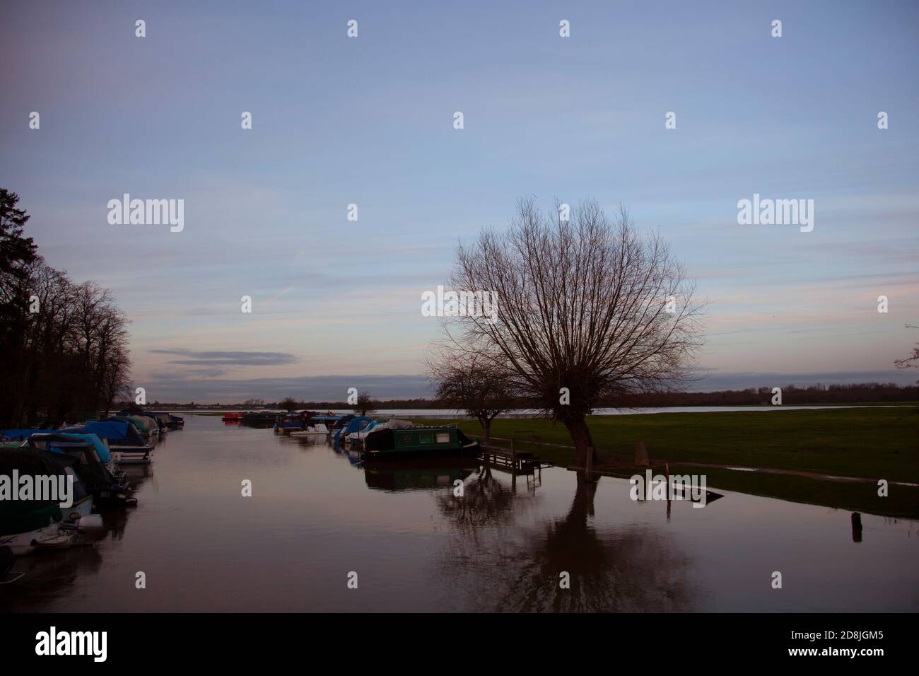 A landscape image featuring a canal in River Thames, near Port Meadow ...