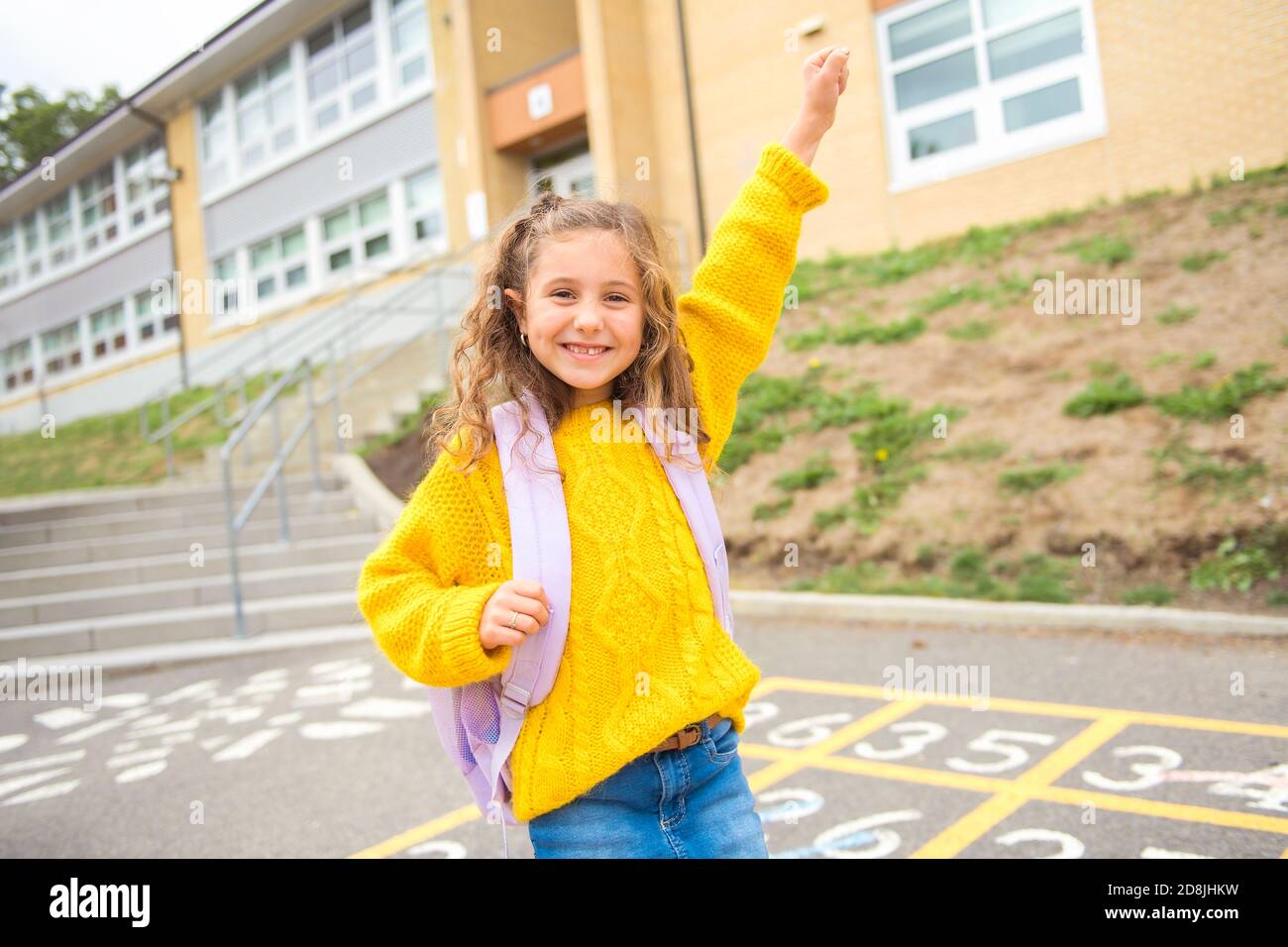 A nice Portrait of cute girl with backpack at school Stock Photo - Alamy