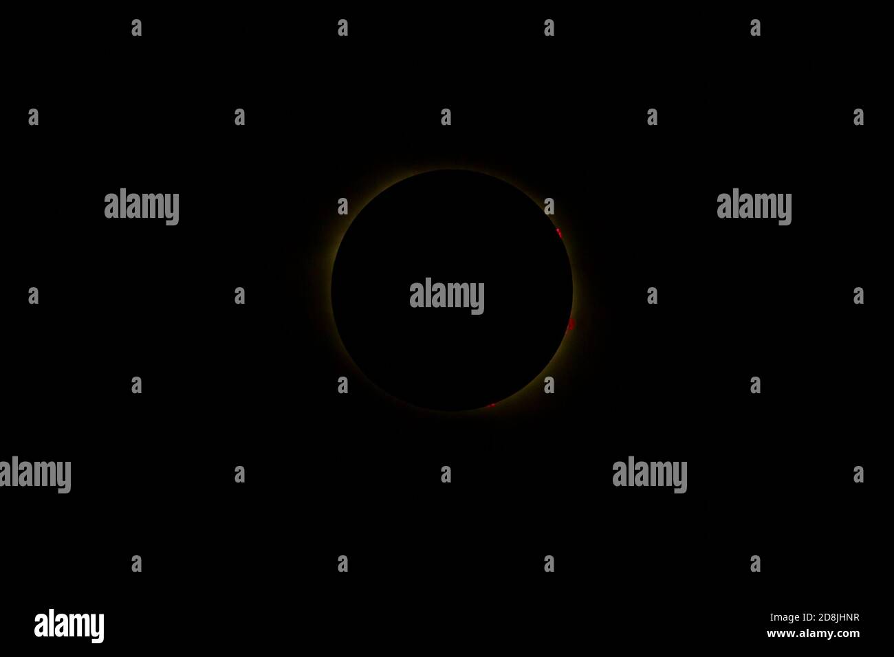 Image of a total solar eclipse taken with a telephoto lens. Massive ...