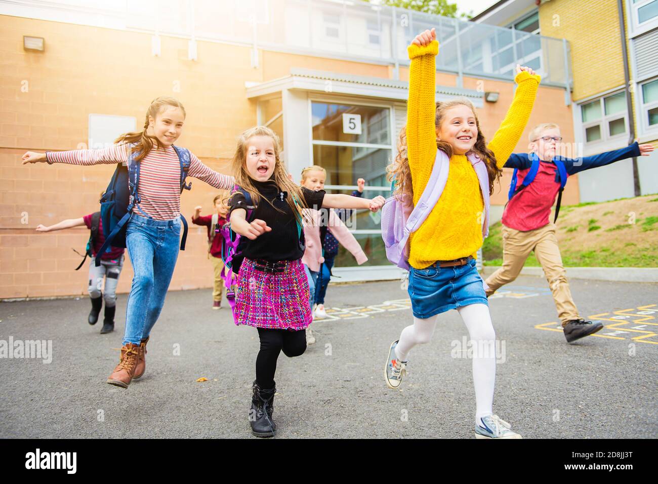 group of kids on the school background having fun Stock Photo - Alamy