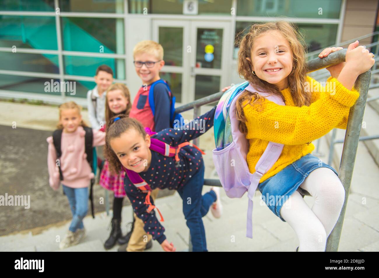 group of kids on the school background having fun Stock Photo - Alamy