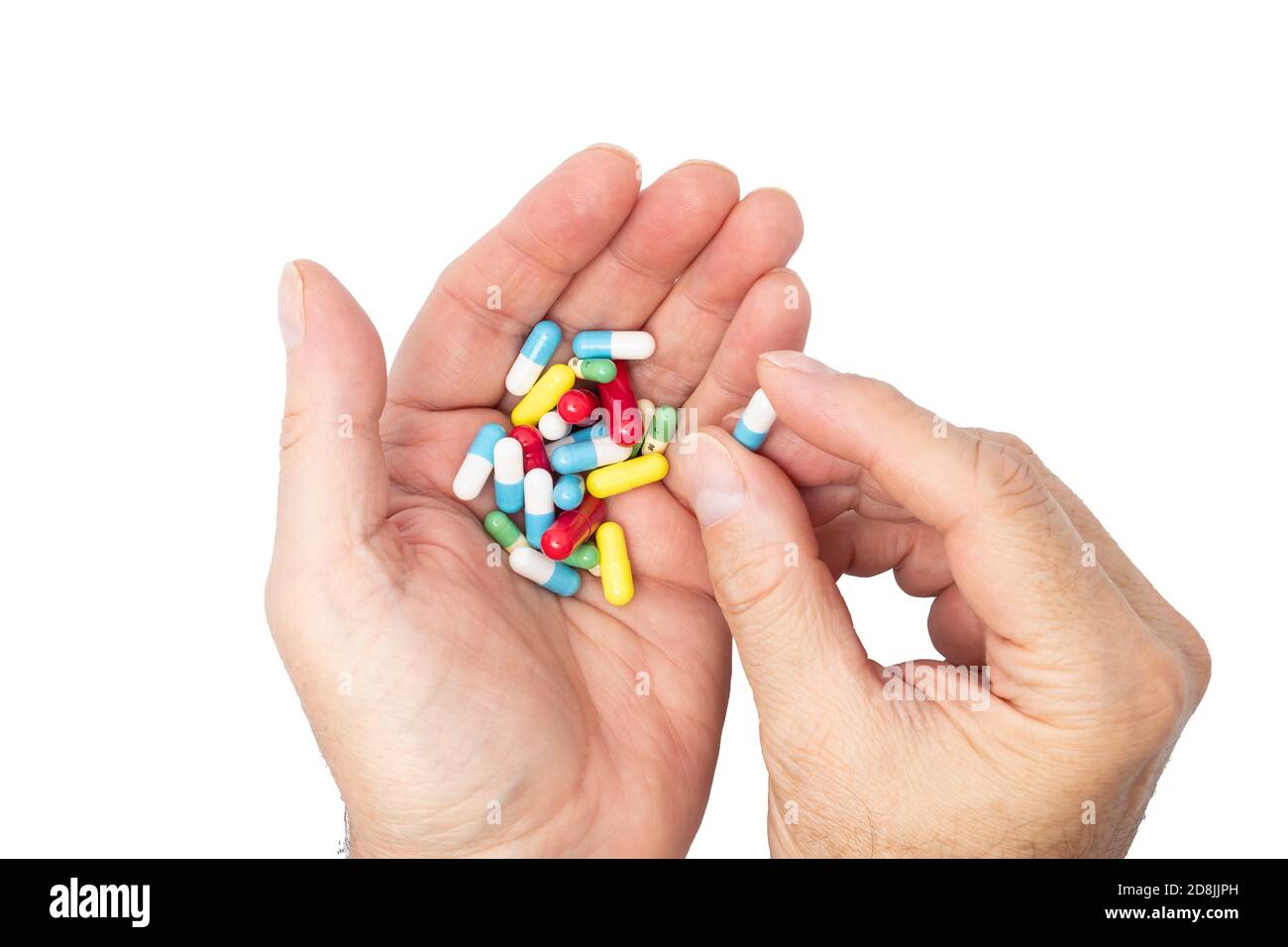 Hand offering a pill between thumb and forefinger Stock Photo - Alamy