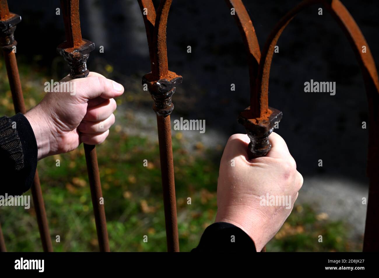 Man behind bars holding hi-res stock photography and images - Alamy