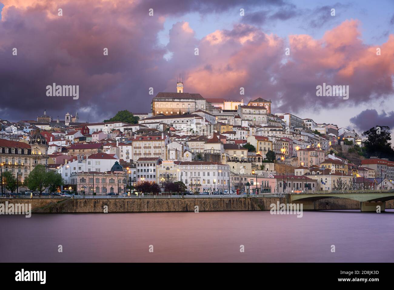 Coimbra city view at sunset with Mondego river and beautiful historic ...
