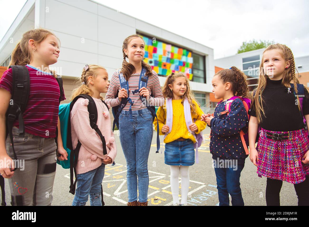 group of kids on the school background having fun Stock Photo - Alamy