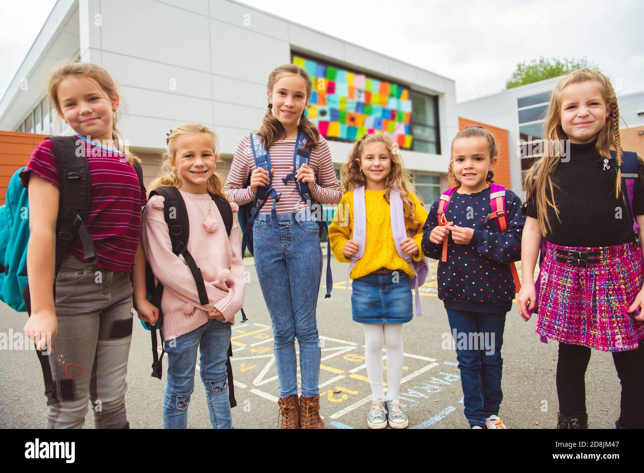 group of kids on the school background having fun Stock Photo - Alamy