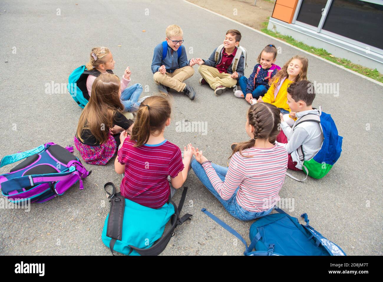group of kids on the school background having fun Stock Photo - Alamy