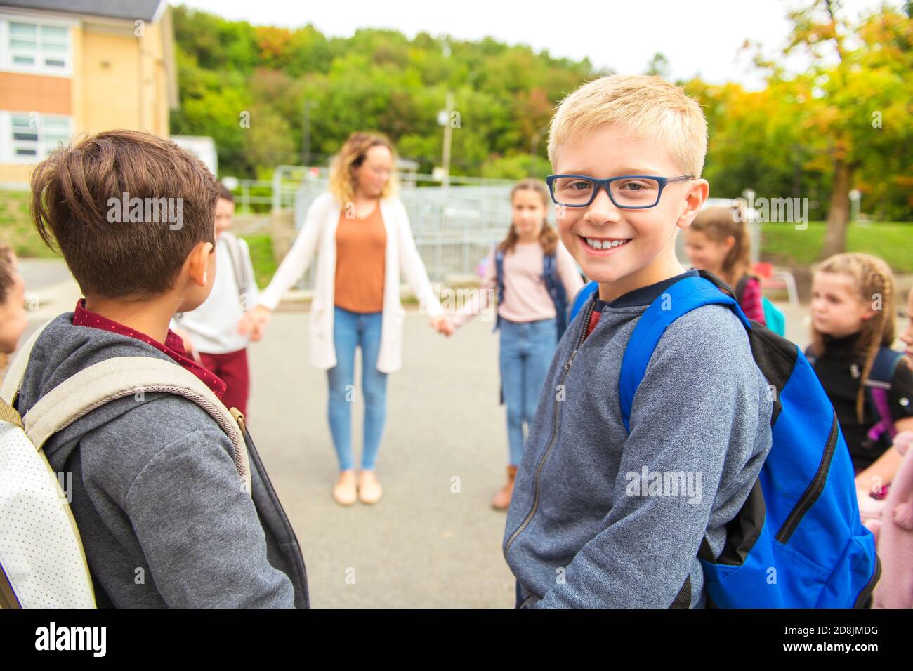 group of kids on the school background having fun Stock Photo - Alamy