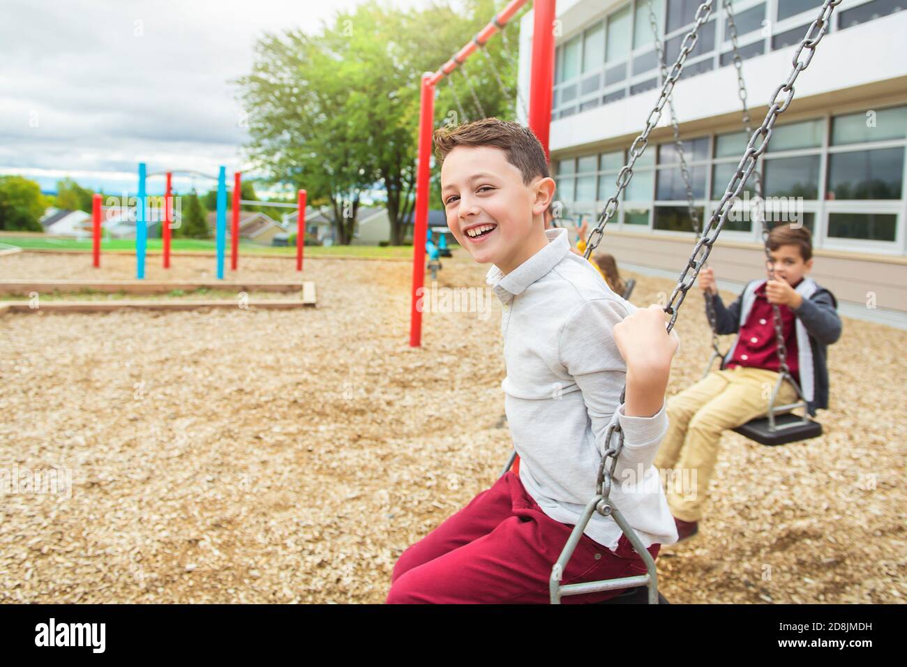 School playground swing slide hi-res stock photography and images - Alamy