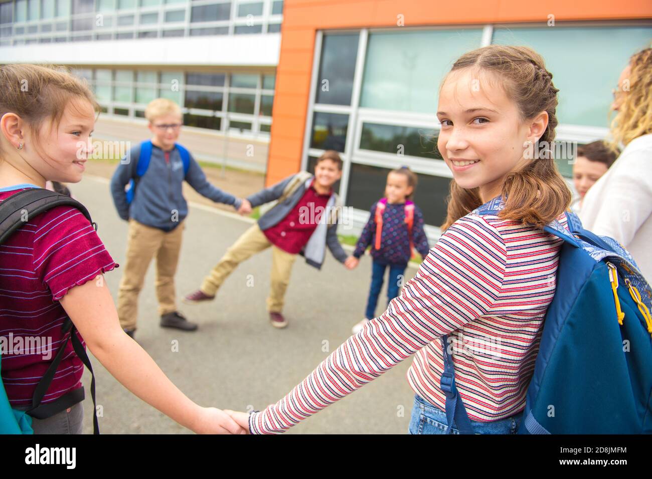 group of kids on the school background having fun Stock Photo - Alamy