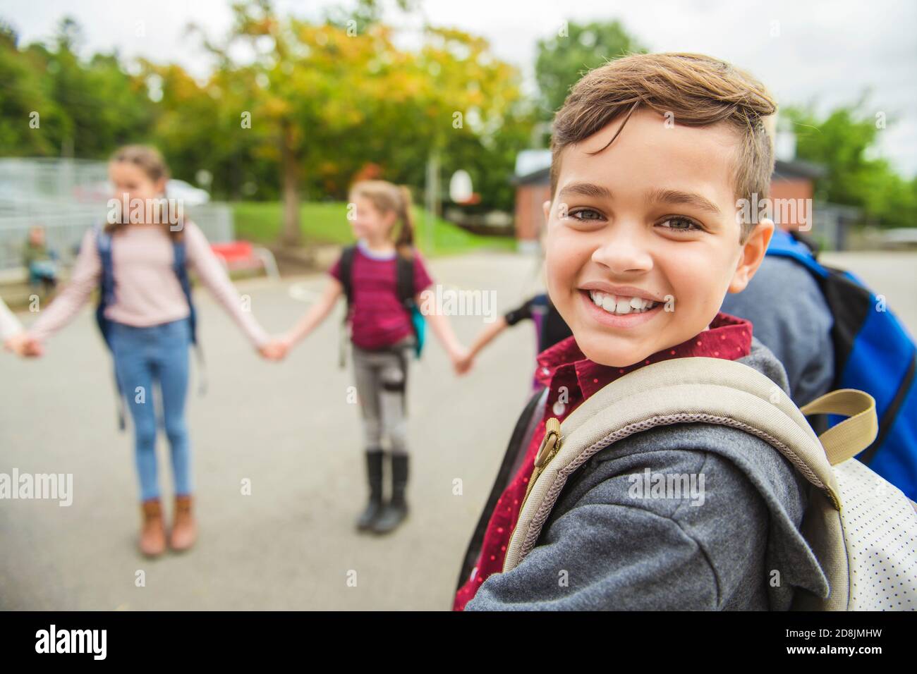 group of kids on the school background having fun Stock Photo - Alamy