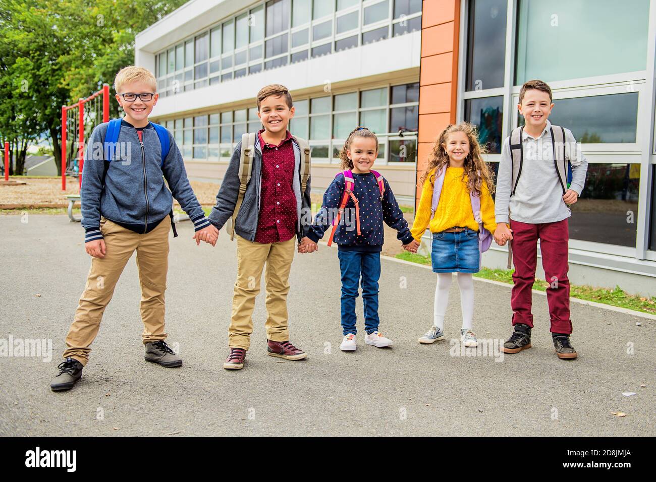 group of kids on the school background having fun Stock Photo - Alamy