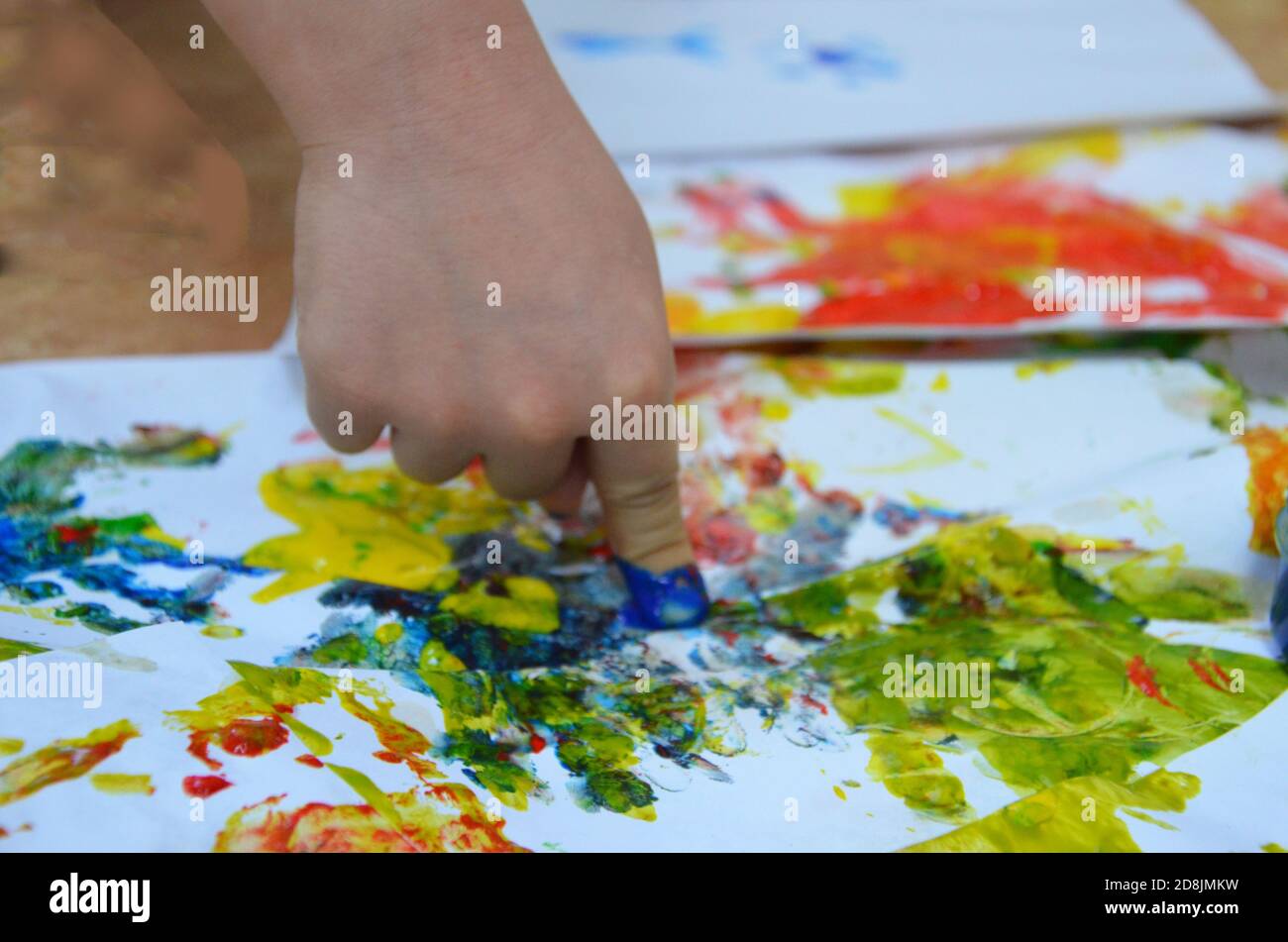 a child draws. a child's drawing inks, finger paints, hand prints with ...