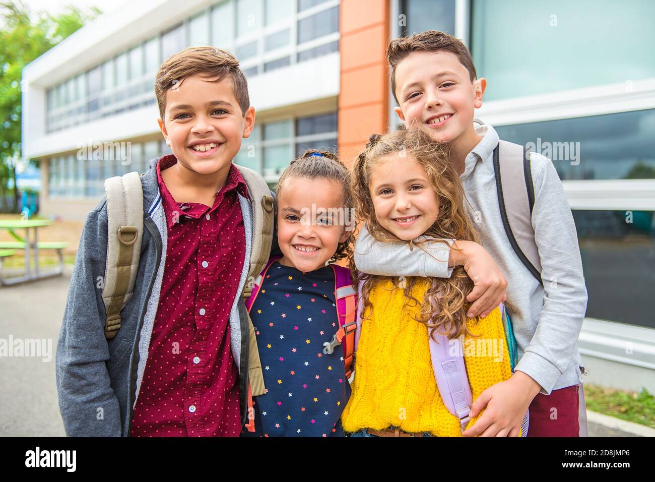 group of kids on the school background having fun Stock Photo - Alamy