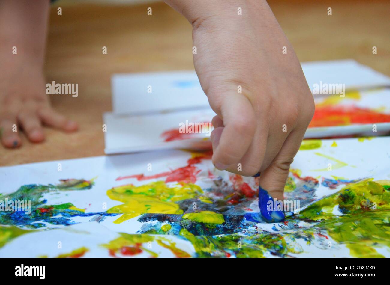 a child draws. a child's drawing inks, finger paints, hand prints with ...