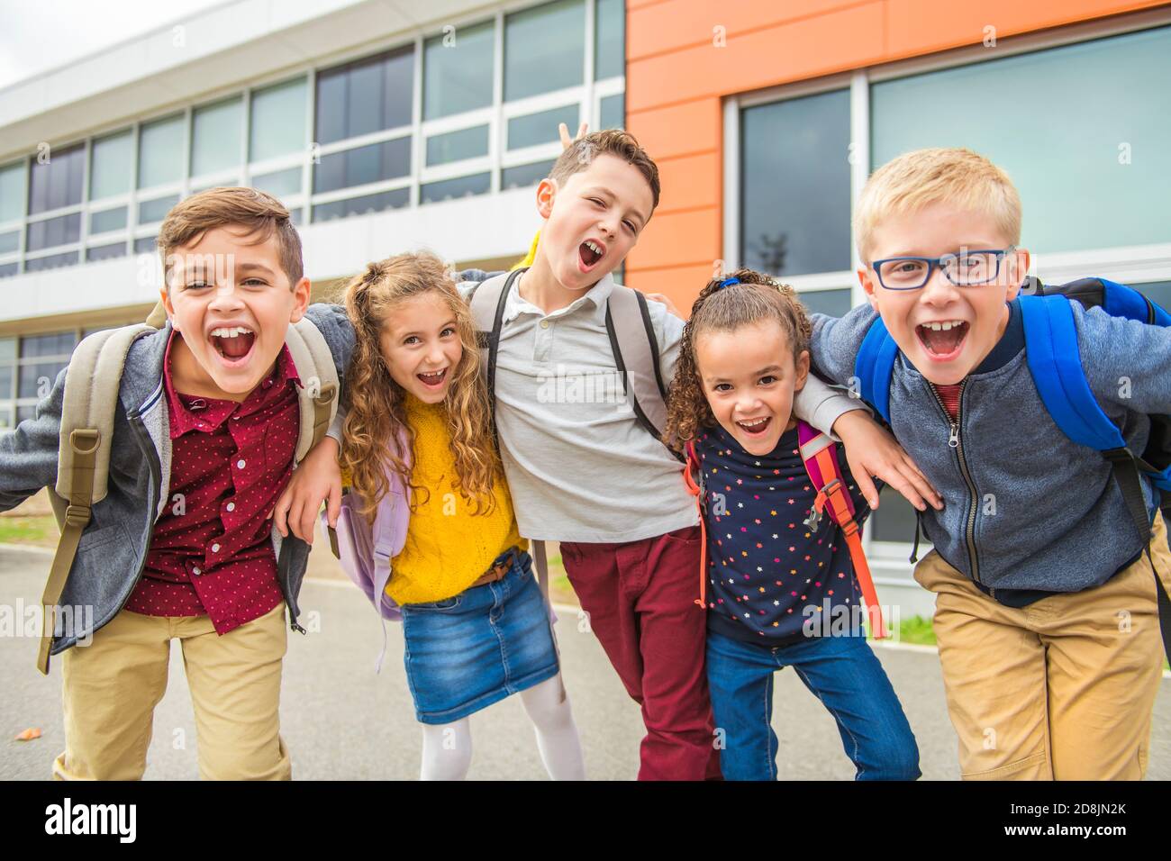 group of kids on the school background having fun Stock Photo - Alamy