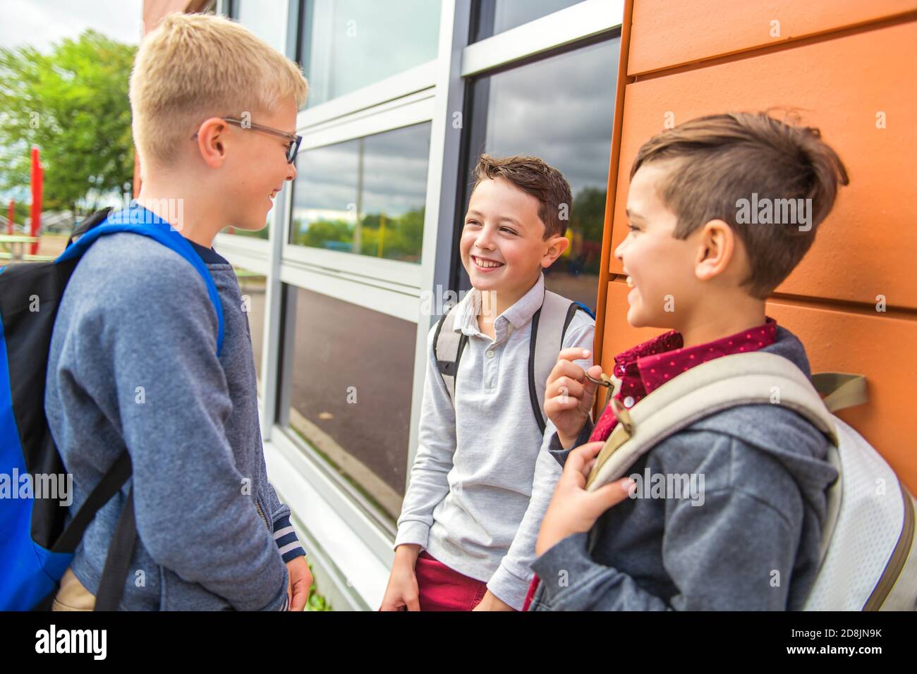 group of kids on the school background having fun Stock Photo - Alamy