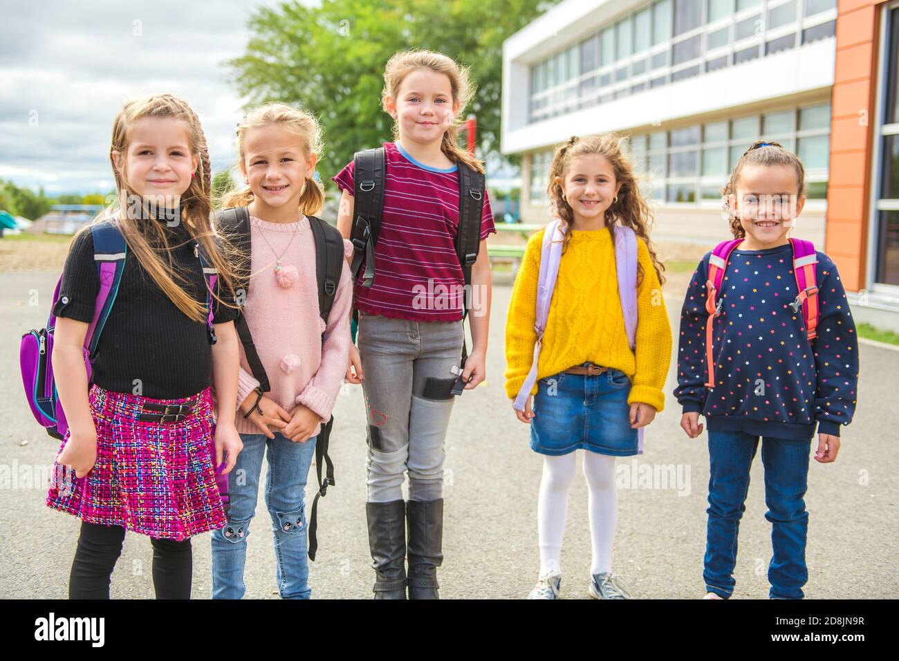 group of kids on the school background having fun Stock Photo - Alamy