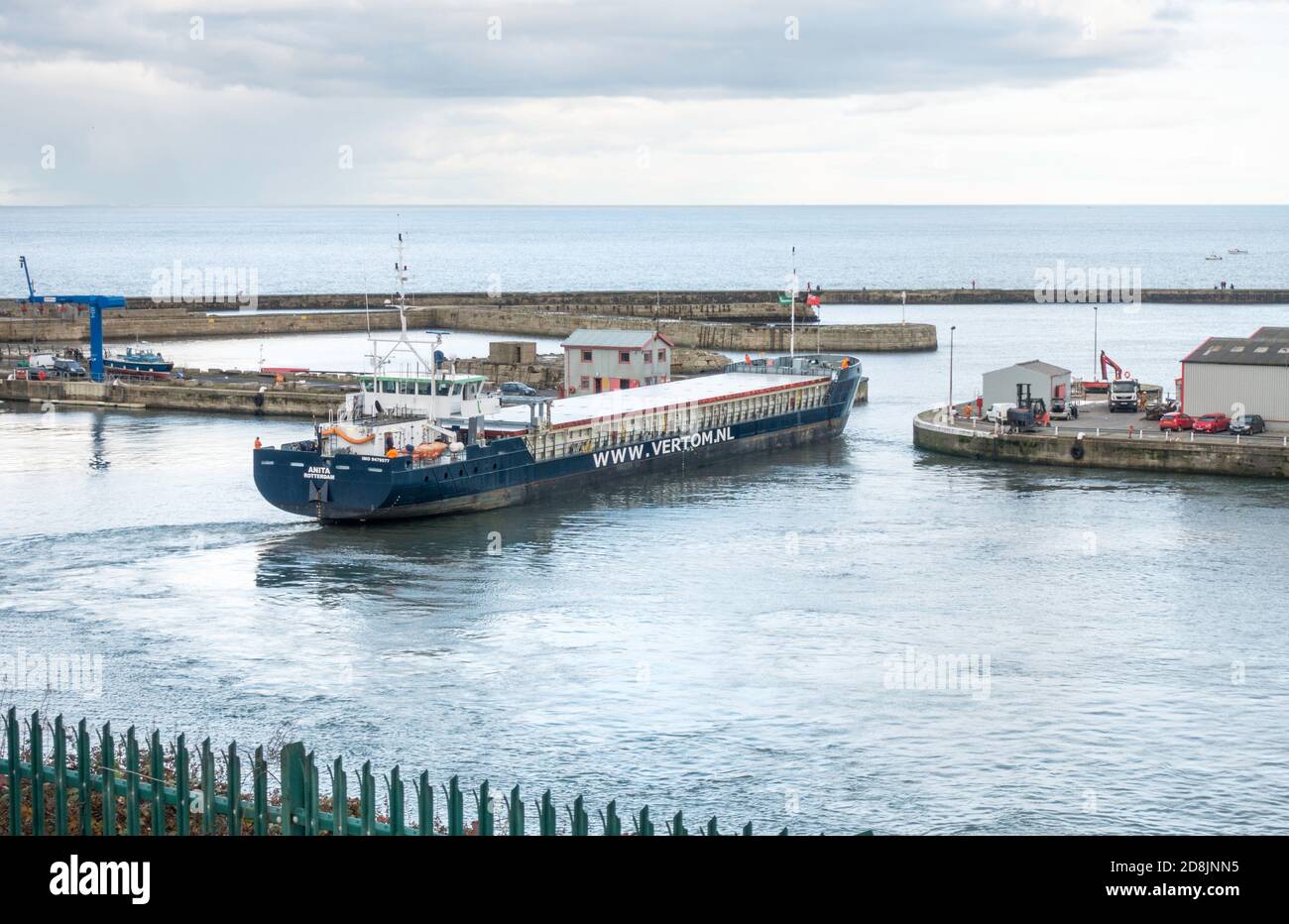 Vertom cargo ship Anita leaving Seaham Harbour through the narrow dock ...