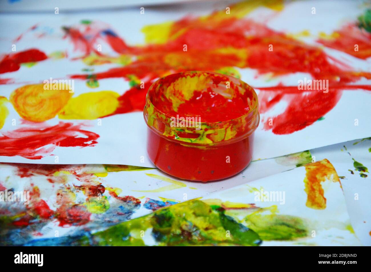 can with paint on a canvas background with an abstract pattern. child's ...