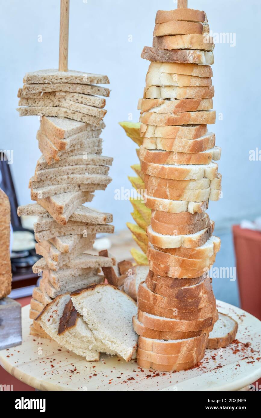 Vertical shot of fresh bread slices stacked on top of each other Stock ...
