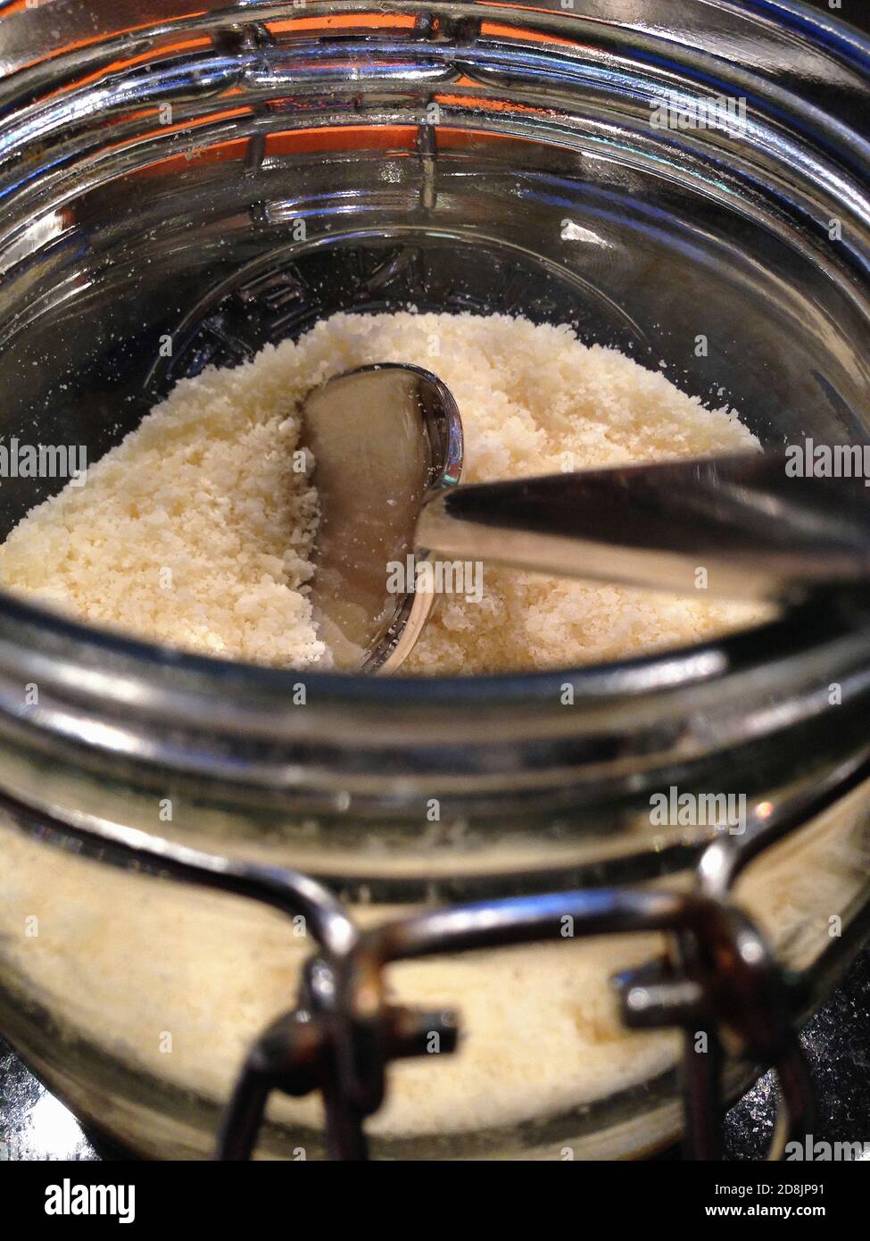 Grated Cheese in Glass Jar Stock Photo - Alamy