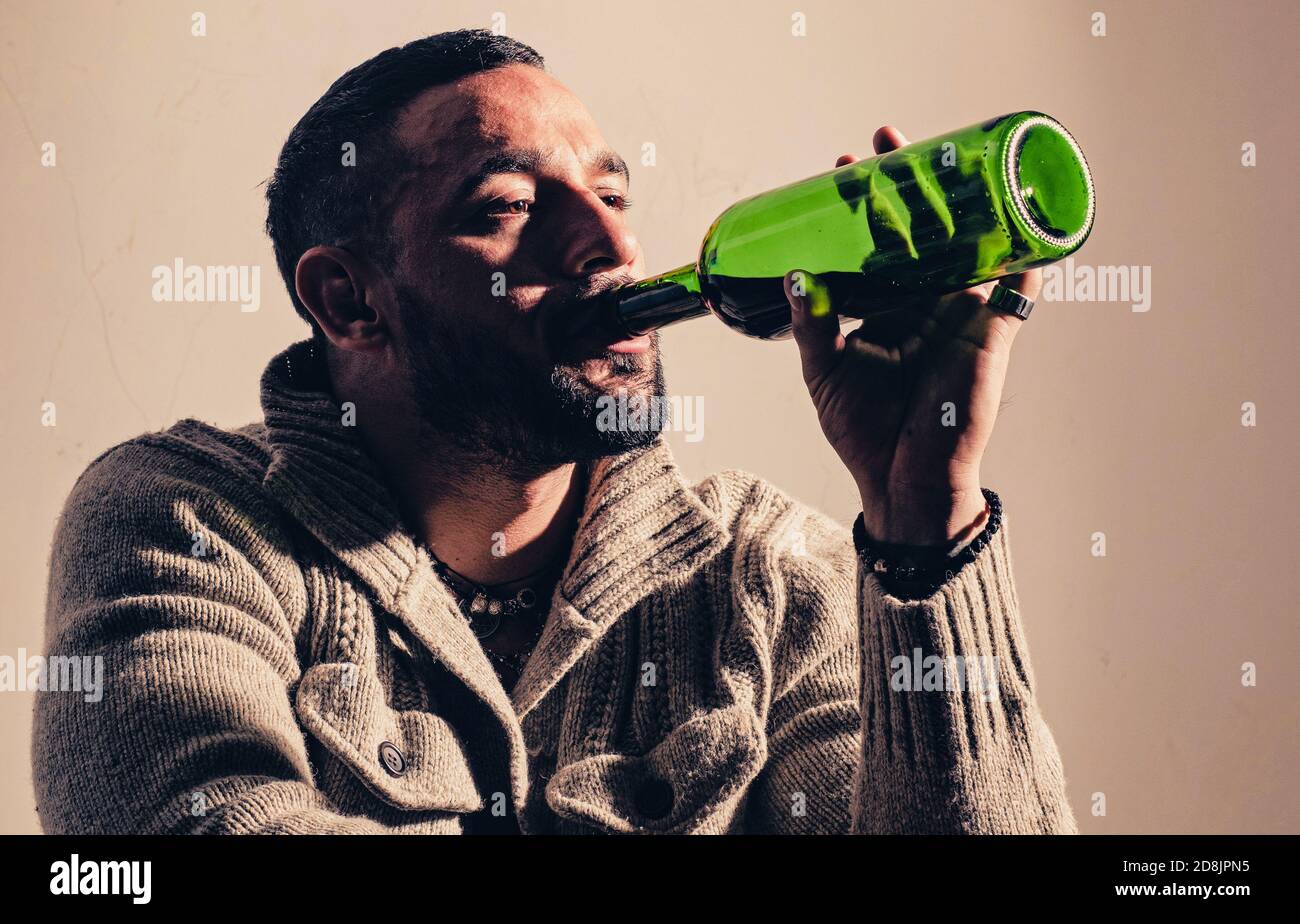 alcoholism, alcohol addiction and people concept. male alcoholic with ...